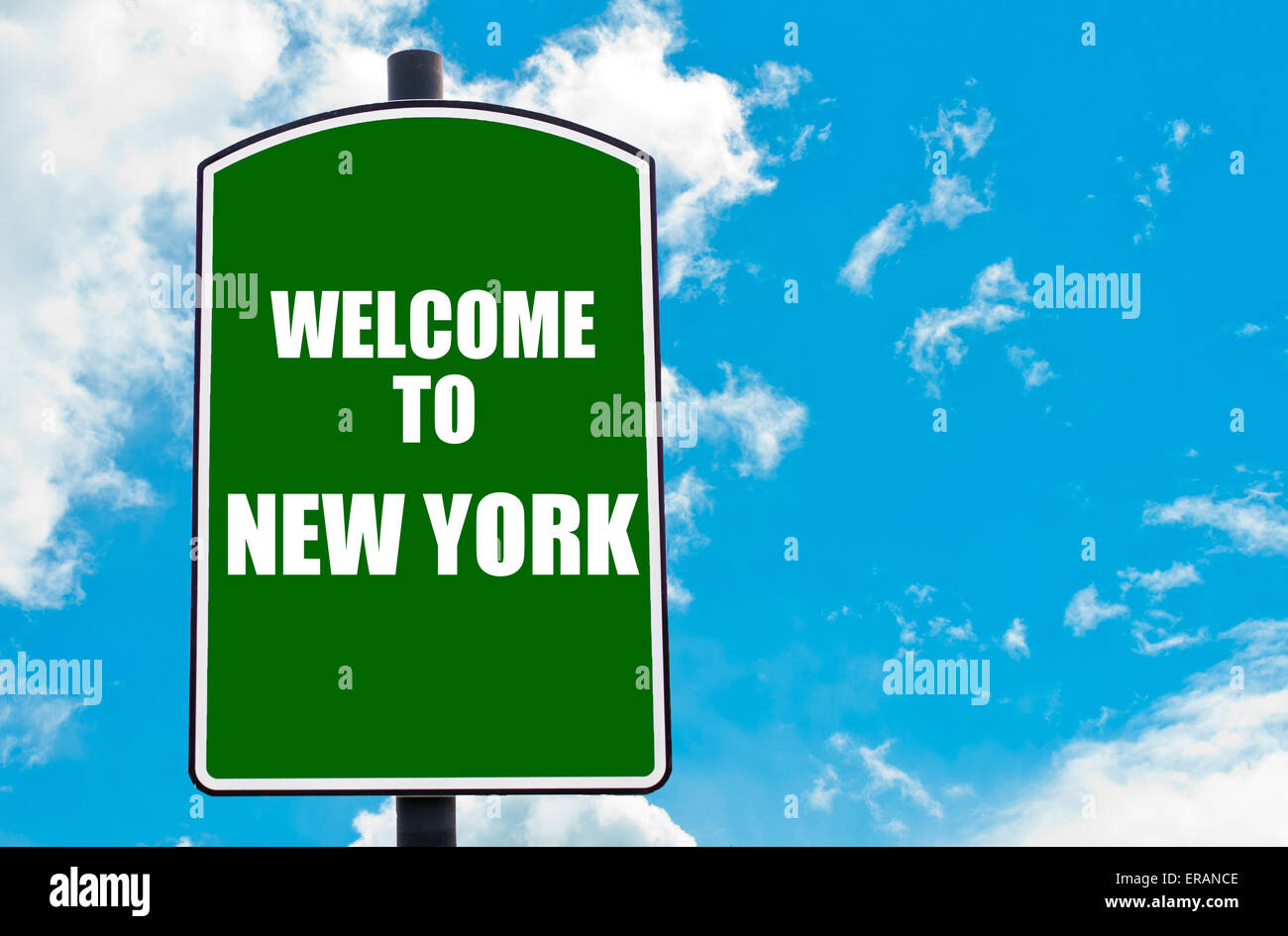 Green road sign with greeting message WELCOME TO NEW YORK isolated over ...