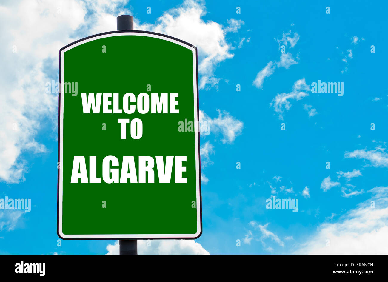 Green road sign with greeting message WELCOME TO ALGARVE, isolated over ...