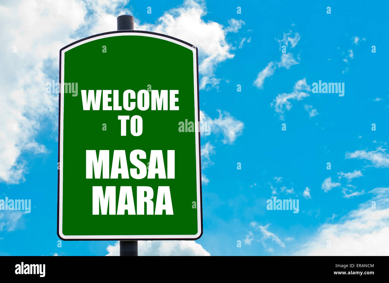 Green road sign with greeting message WELCOME TO MASAI MARA isolated ...