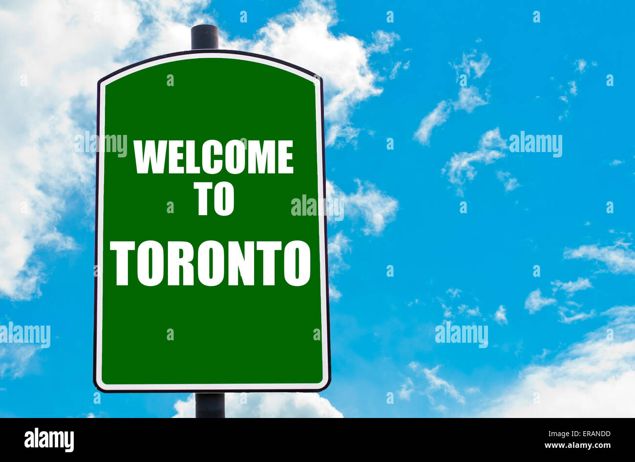 Green road sign with greeting message WELCOME TO TORONTO, CANADA ...