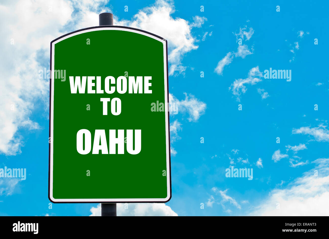 Green road sign with greeting message WELCOME TO OAHU isolated over ...