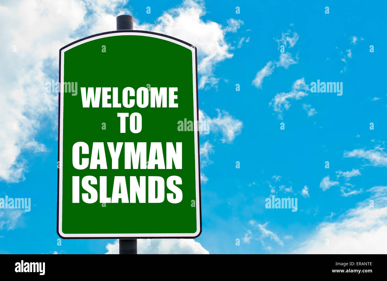 Green road sign with greeting message WELCOME TO CAYMAN ISLANDS ...
