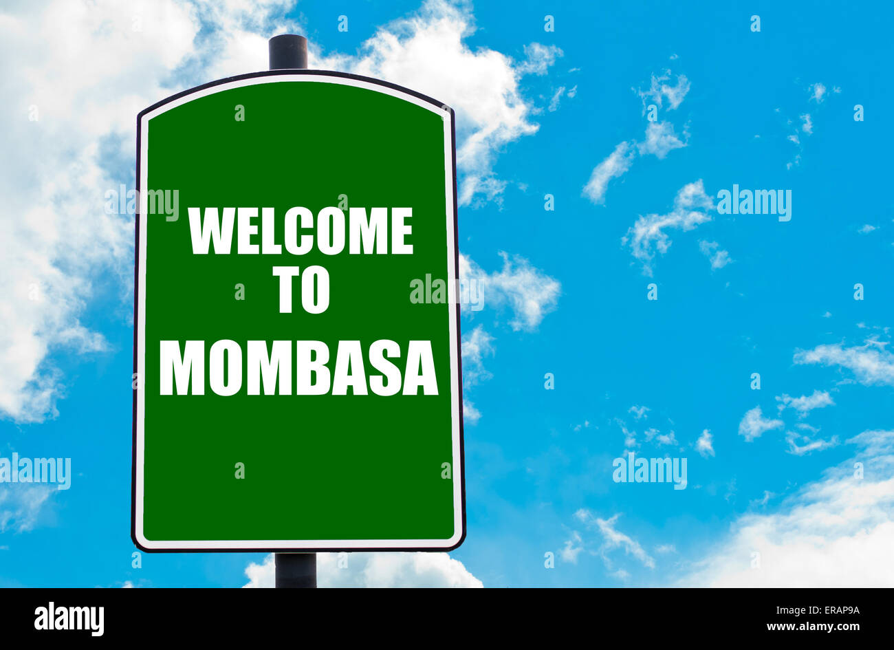 Green road sign with greeting message WELCOME TO MOMBASA isolated over ...