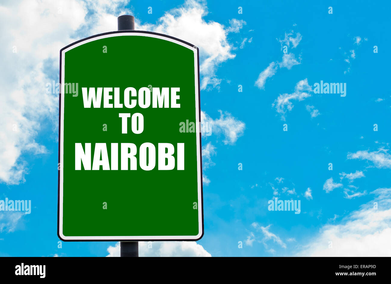 Green road sign with greeting message WELCOME TO NAIROBI isolated over ...
