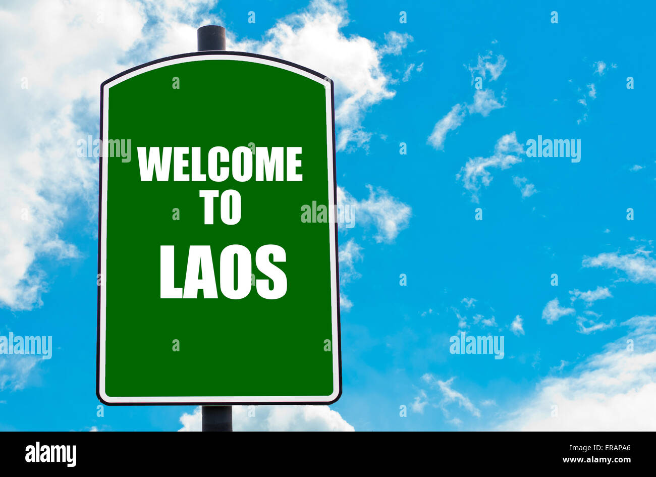 Green road sign with greeting message WELCOME TO LAOS isolated over ...