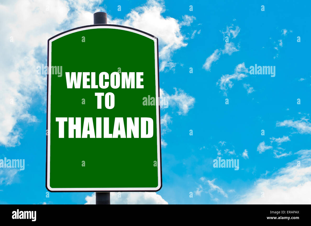 Green road sign with greeting message WELCOME TO THAILAND isolated over ...