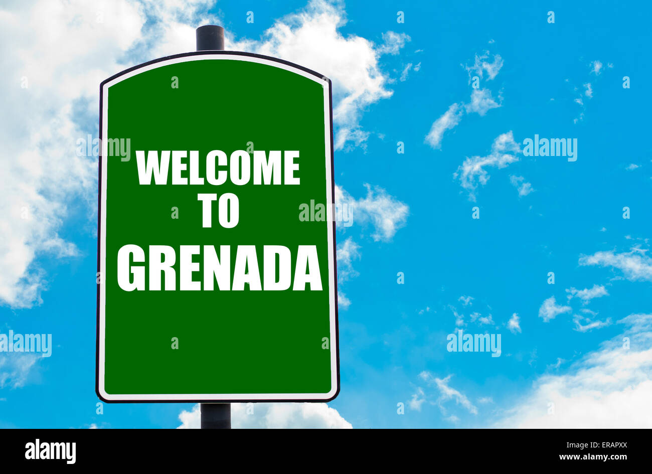 Green road sign with greeting message WELCOME TO GRENADA isolated over ...
