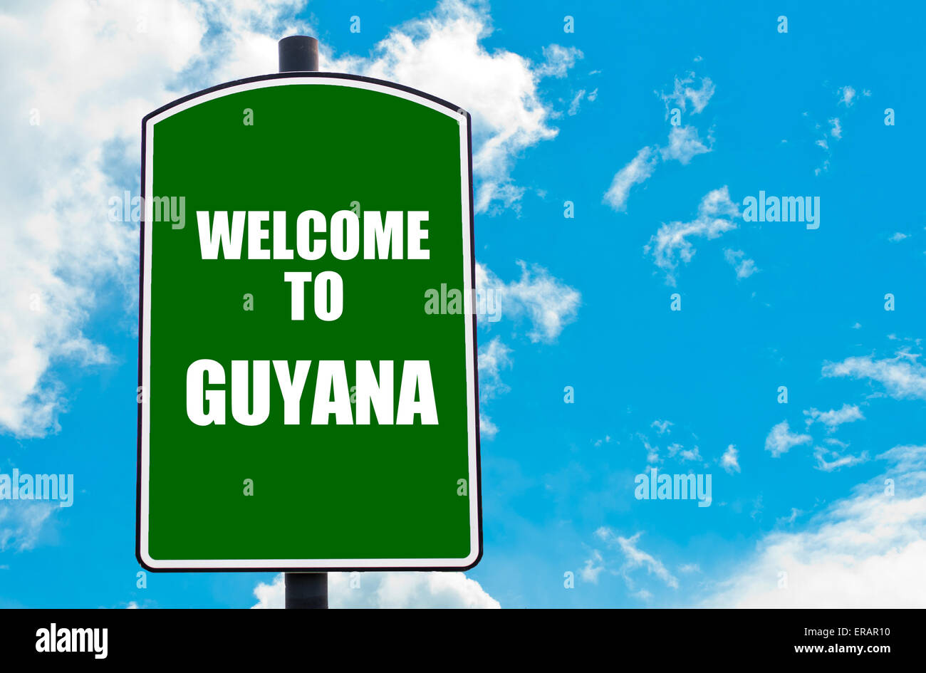 Green road sign with greeting message WELCOME TO GUYANA isolated over ...