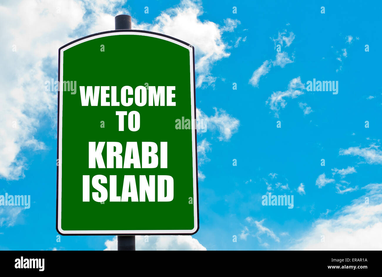 Green road sign with greeting message WELCOME TO KRABI ISLAND, THAILAND ...