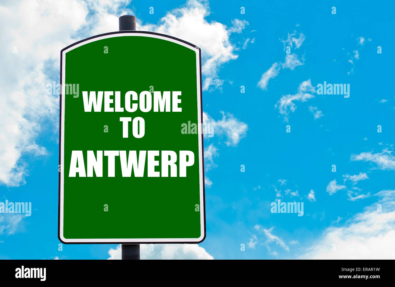 Green road sign with greeting message WELCOME TO ANTWERP isolated over ...