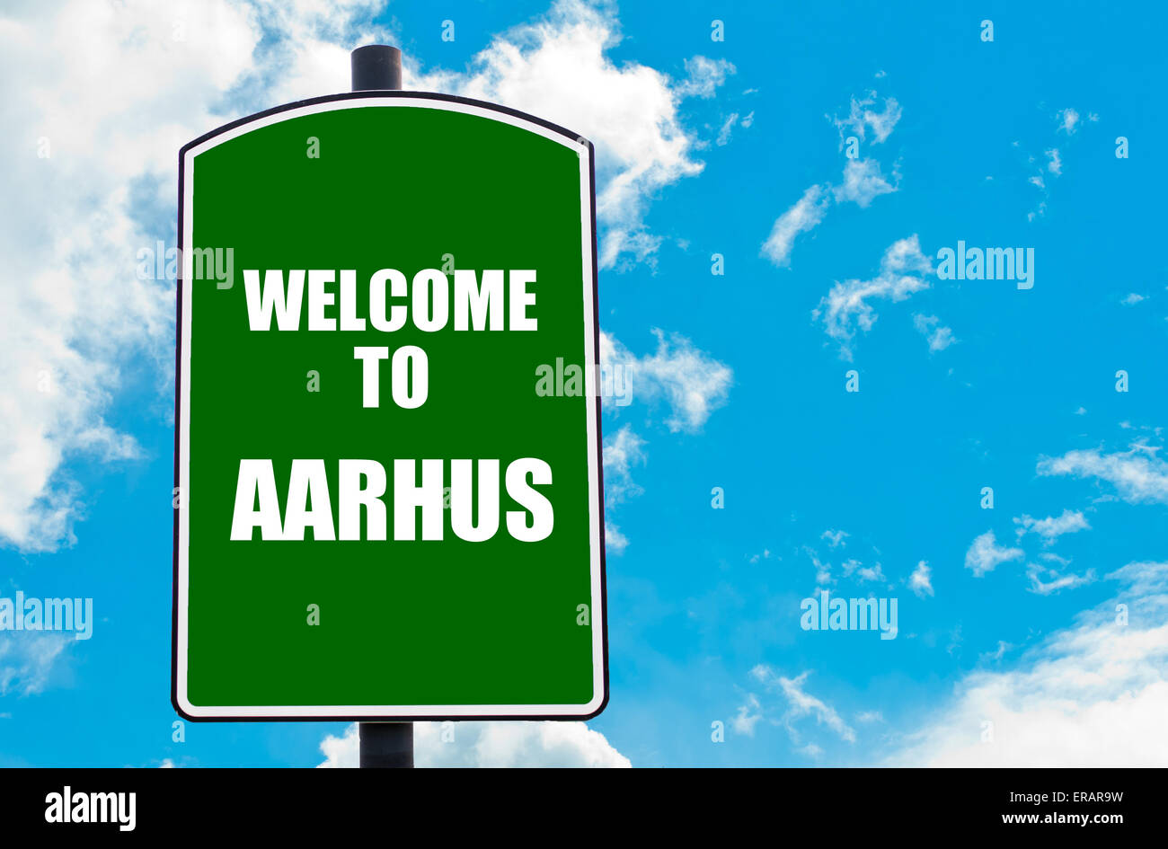 Green road sign with greeting message WELCOME TO AARHUS isolated over ...