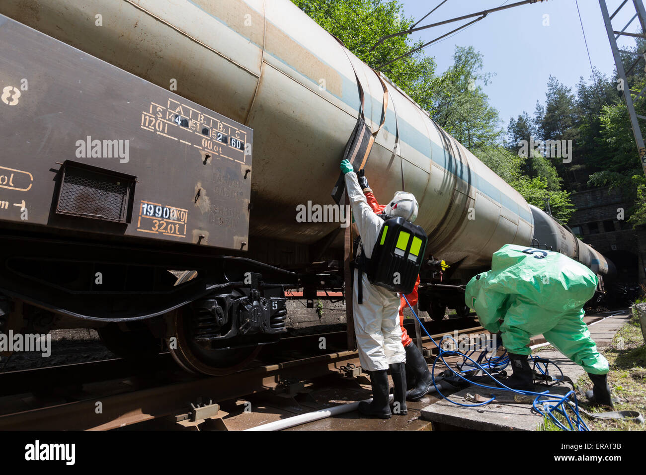 A team working with toxic acids and chemicals is securing a chemical ...