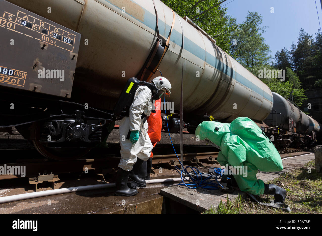 A team working with toxic acids and chemicals is securing a chemical ...