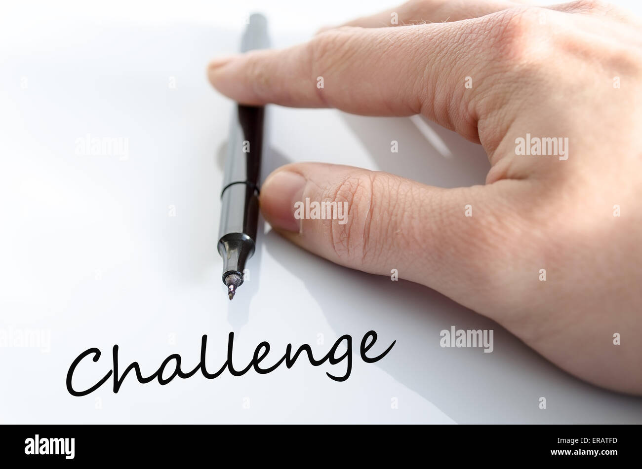 Pen in the hand isolated over white background Challenge Concept Stock ...