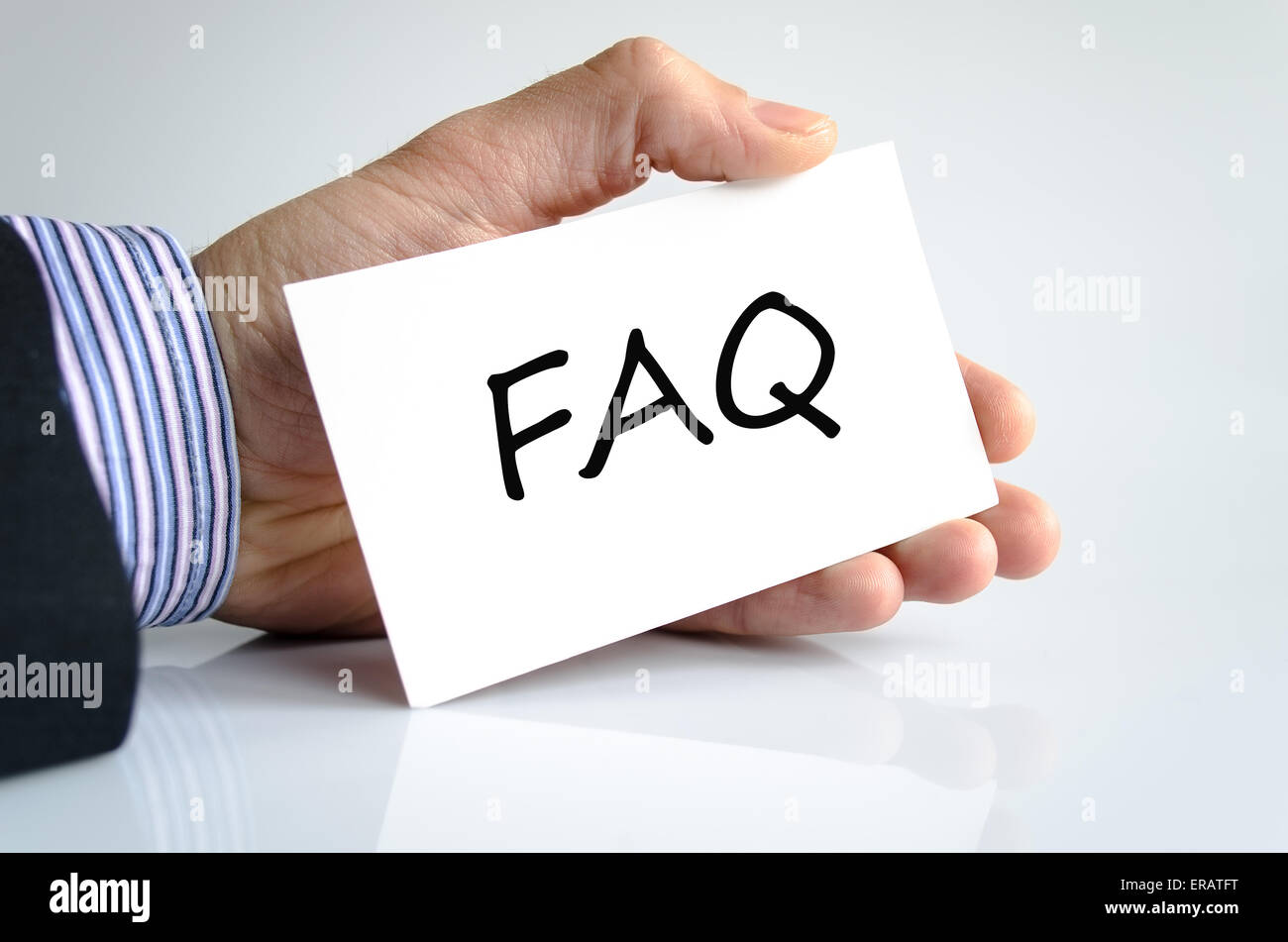 Faq note in business man hand Stock Photo - Alamy