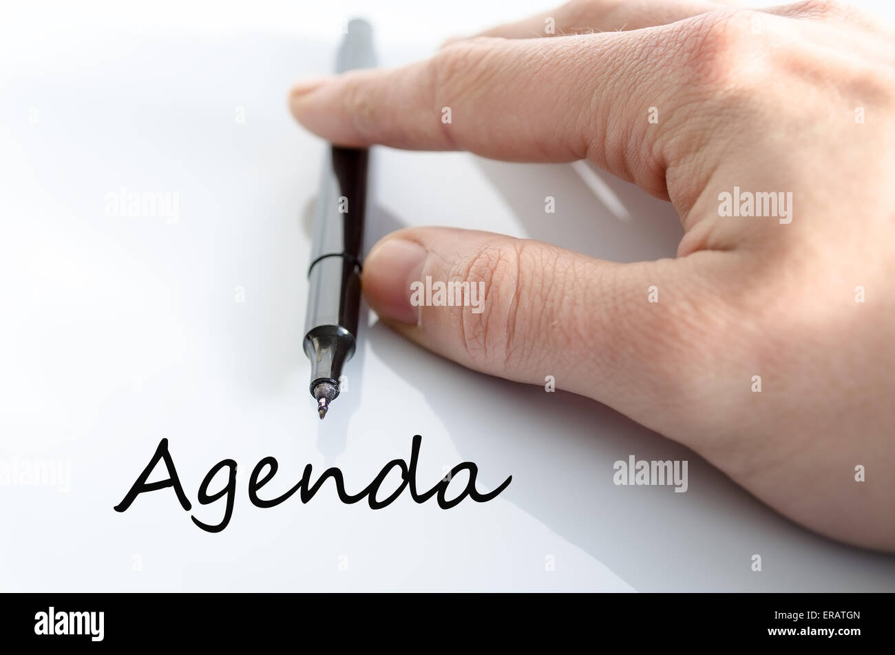 Pen in the hand isolated over white background Agenda concept Stock ...