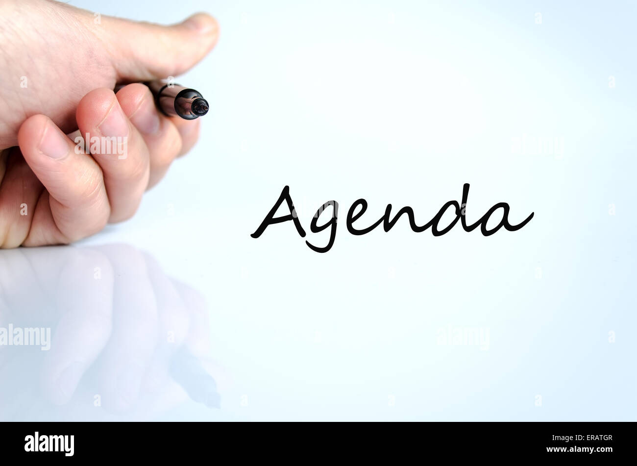 Pen in the hand isolated over white background Agenda concept Stock ...