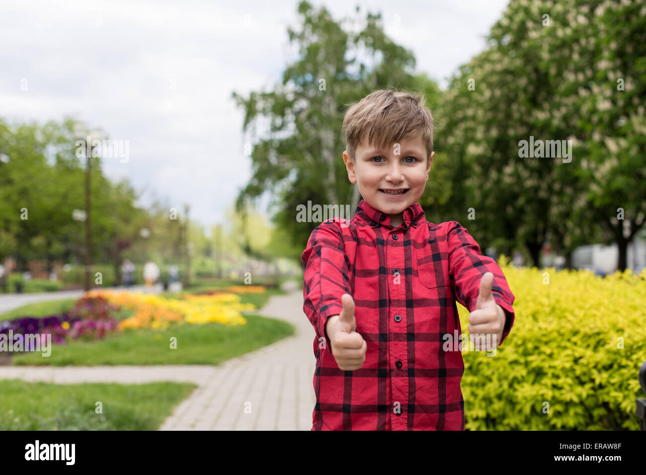 Young happy little boy in the red shirt Stock Photo - Alamy