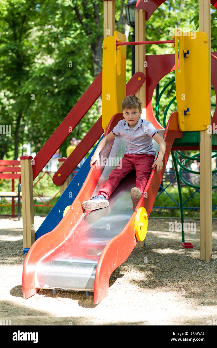 Little boy playing at playground on a sunny day Stock Photo - Alamy