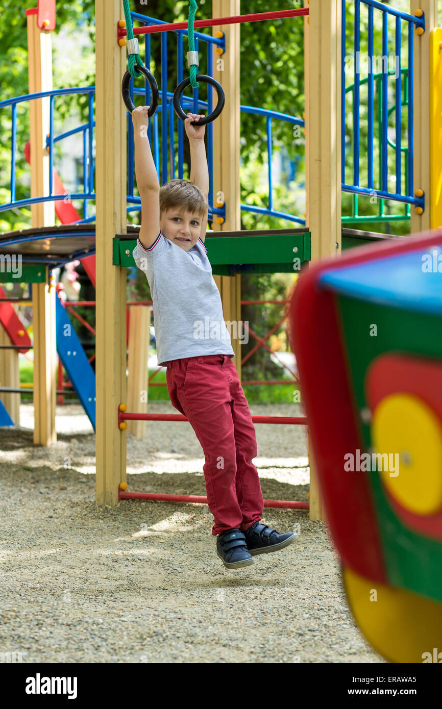 Little boy playing at playground on a sunny day Stock Photo - Alamy
