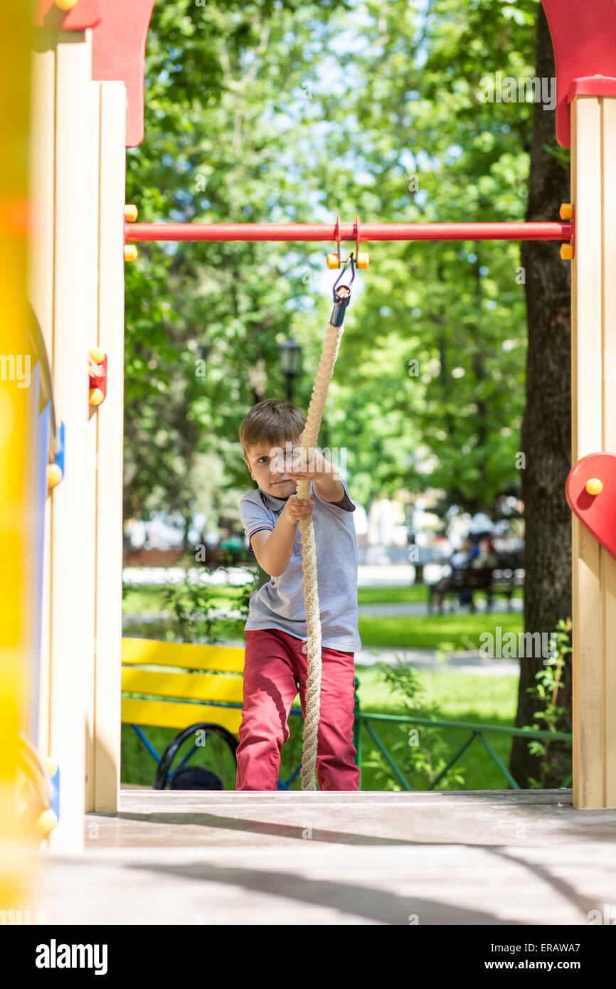 Cheerful little boy on playground hi-res stock photography and images - Alamy