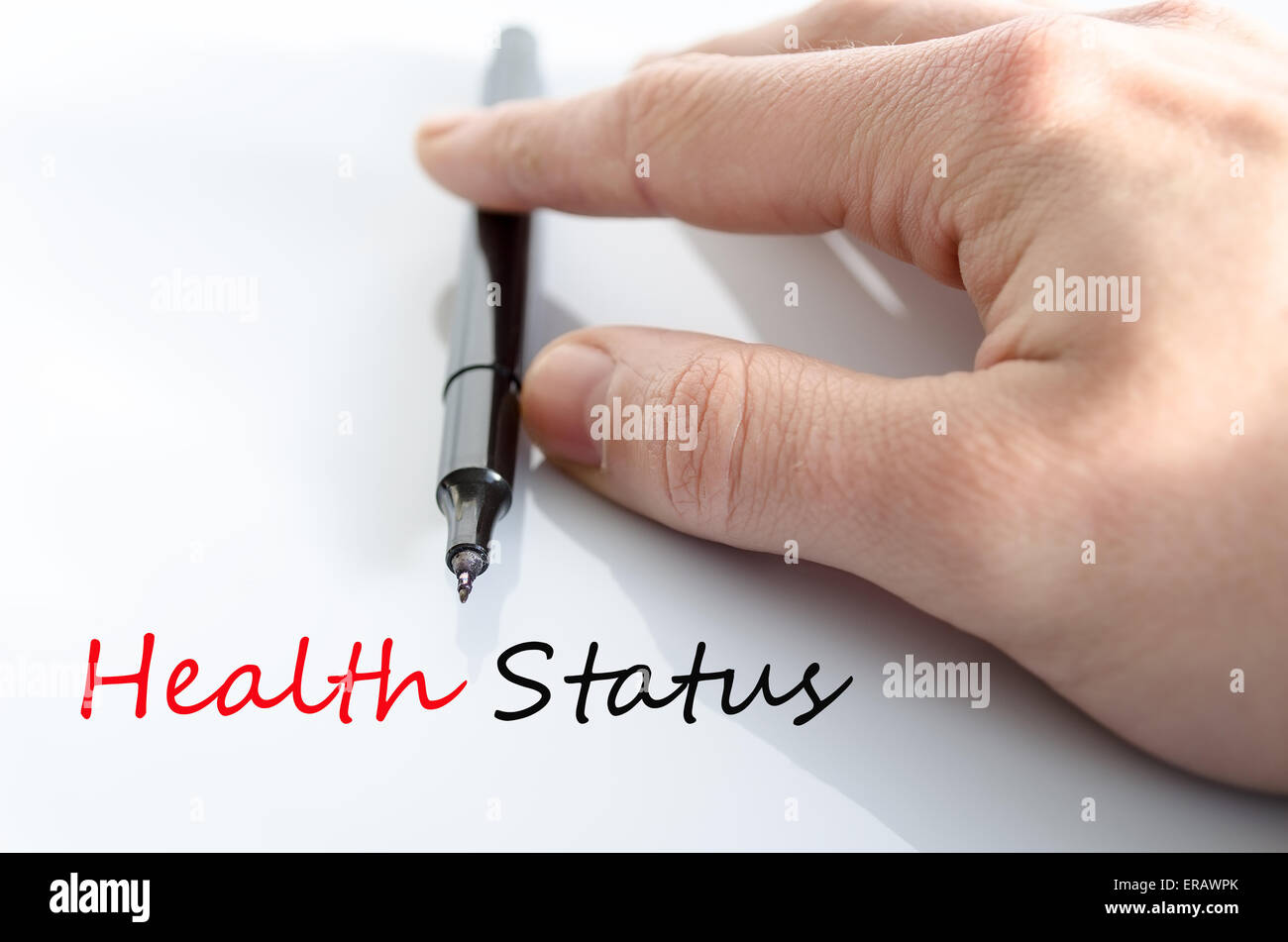 Pen in the hand isolated over white background Health Status concept ...