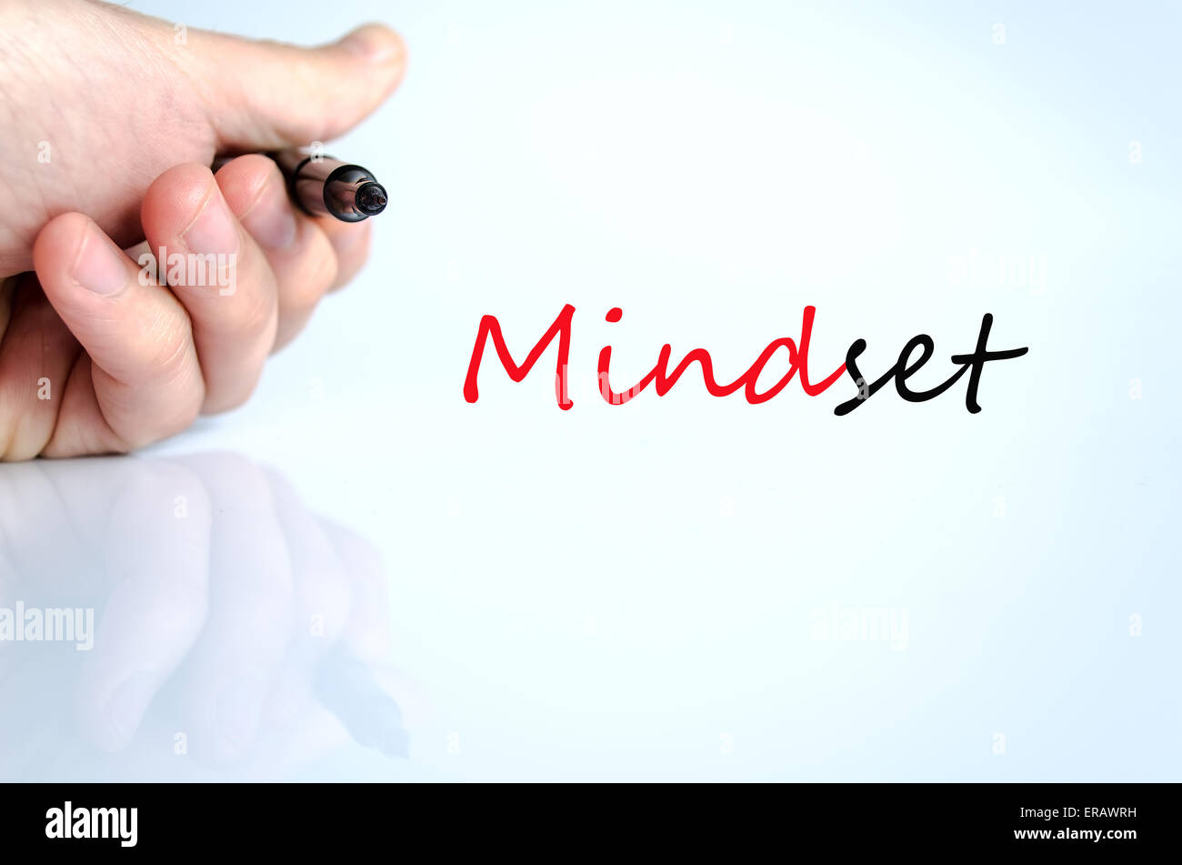 Pen in the hand isolated over white background Mindset Stock Photo - Alamy