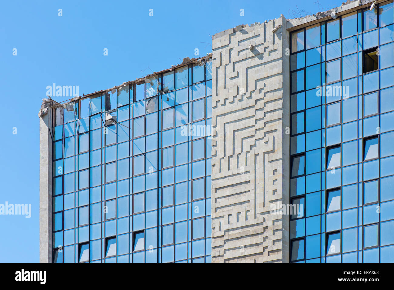 Demolition modern building in process Stock Photo - Alamy