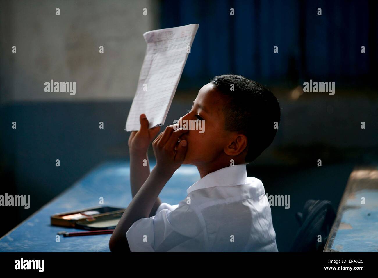 Bhaktapur, Nepal. 31st May, 2015. A Nepalese student shows his first ...
