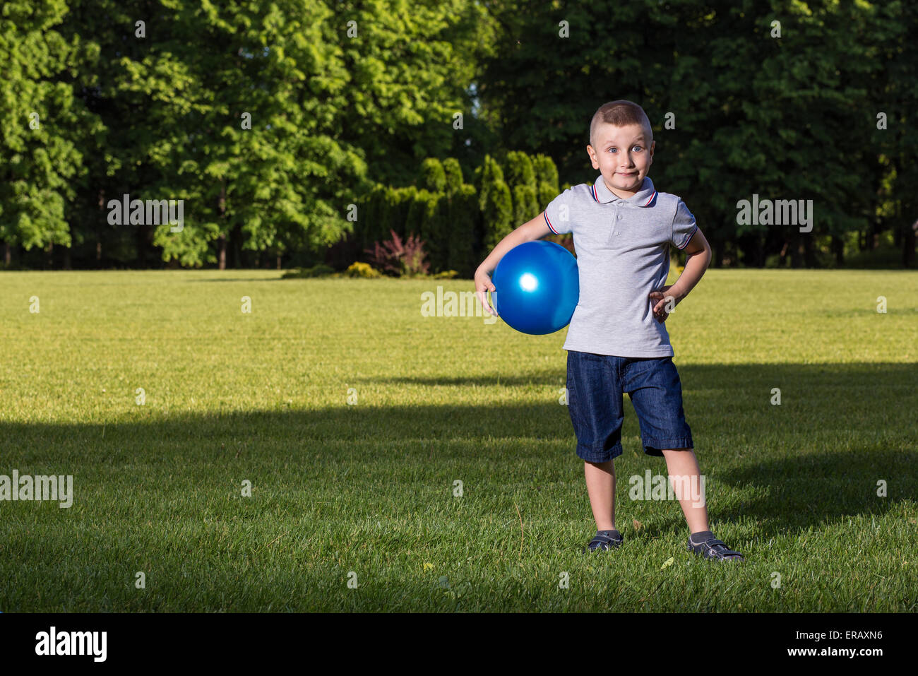 Boy children playing ball Stock Photo - Alamy
