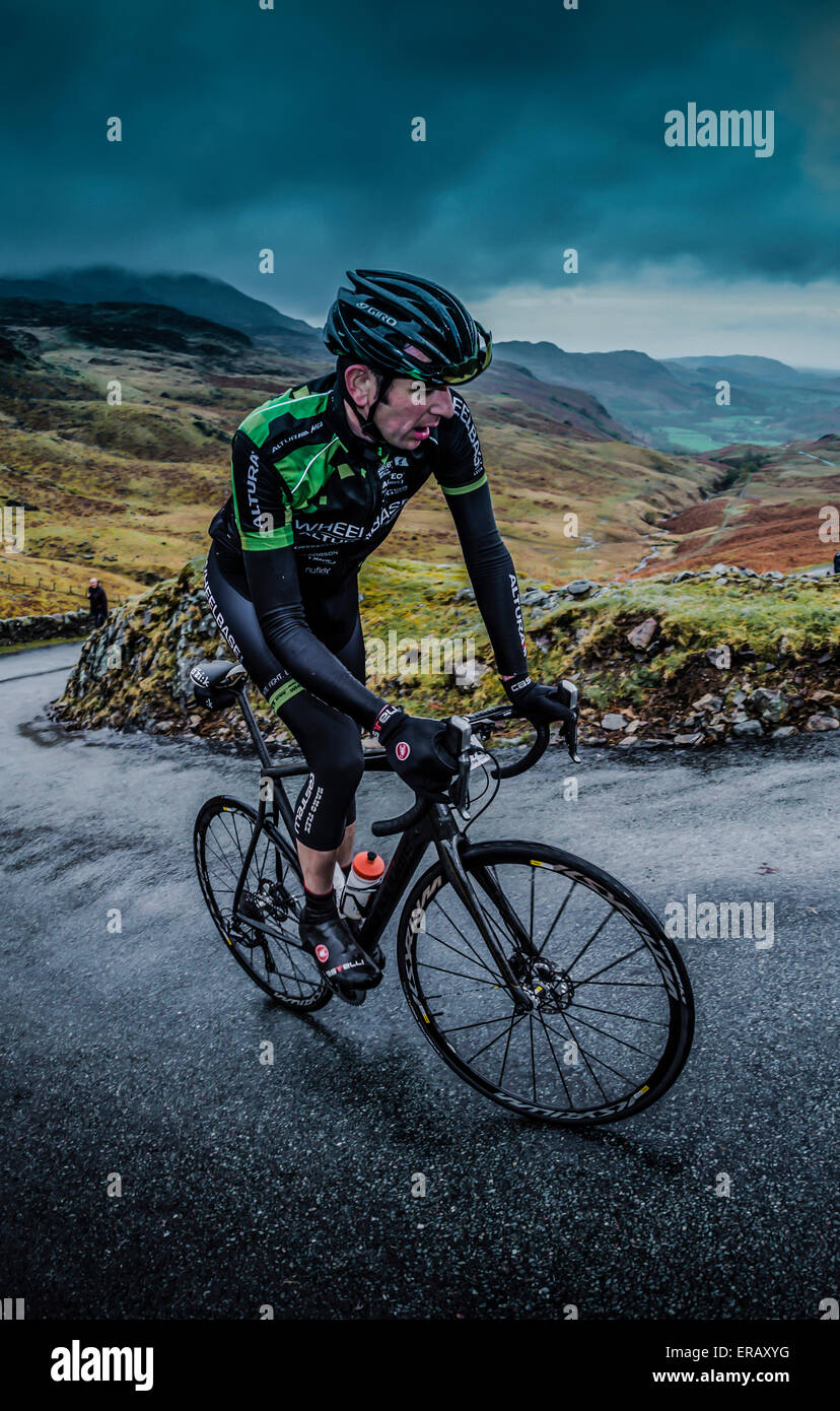 Cyclist taking part in the Fred Whitton Challenge 2015, riding ...