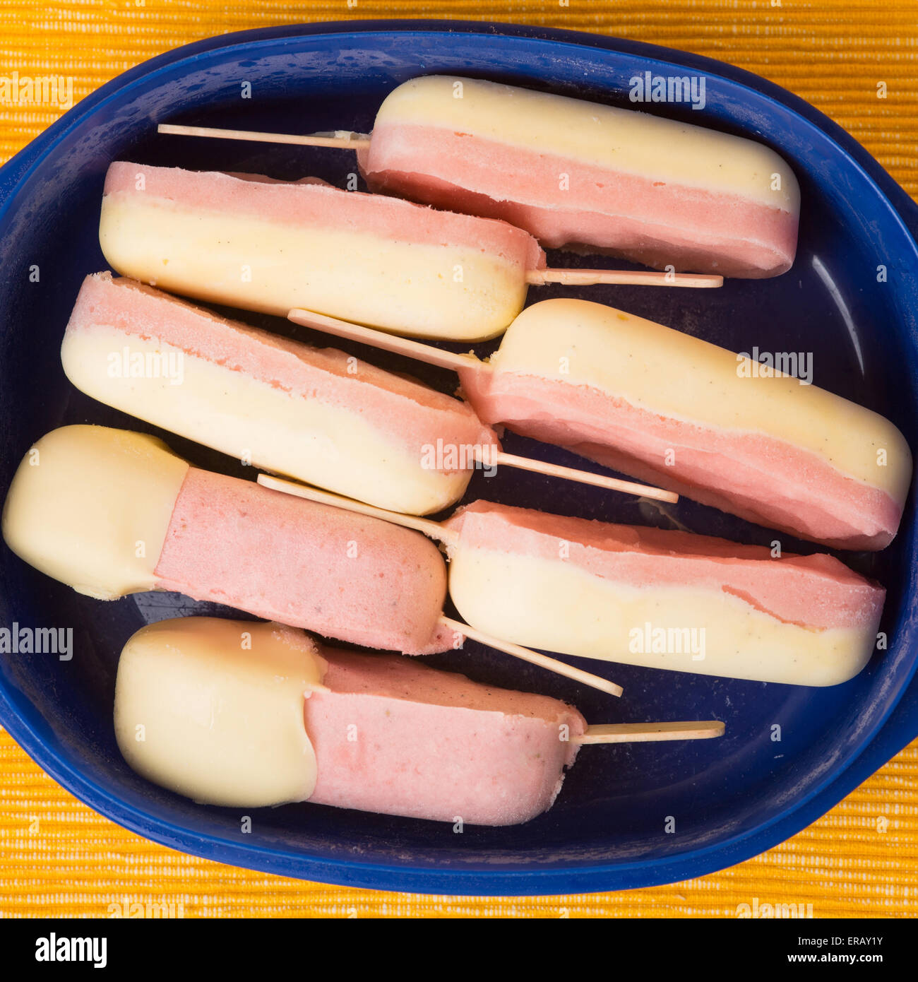 Homemade strawberry ice cream popsicles with white chocolate in a box ...