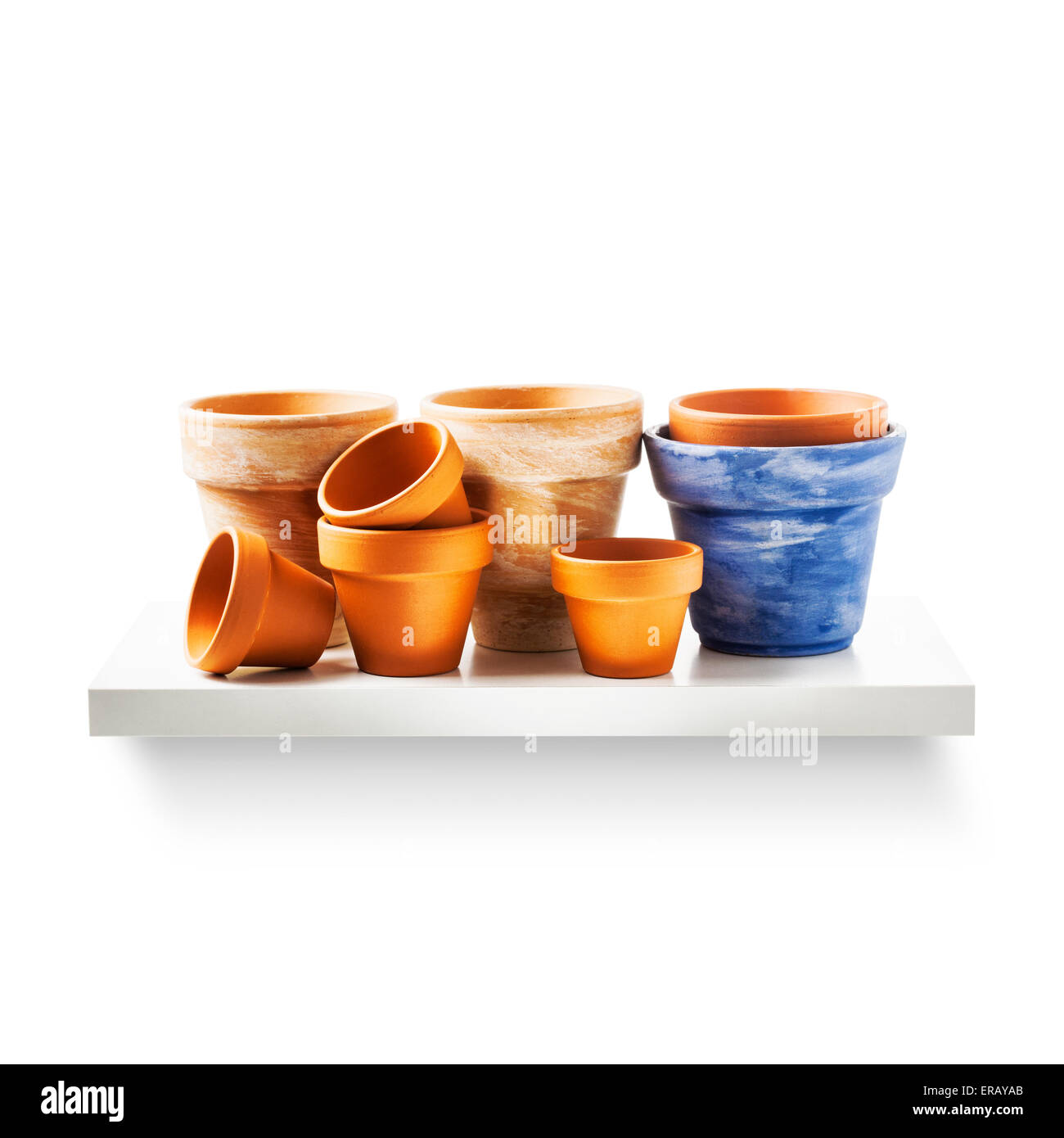 Clay flower pots on shelf isolated on white background. Garden ...
