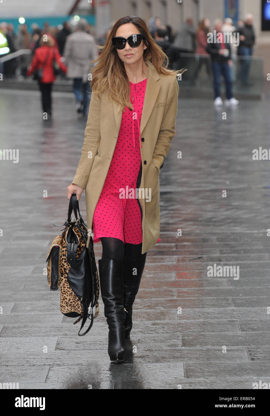 Myleene Klass leaves Smooth Radio, wearing a pink spotty dress, tanned ...