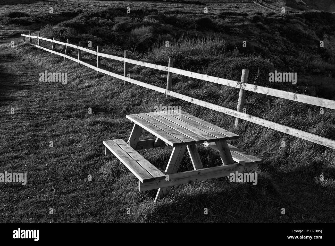 A bench next to a coastal path Stock Photo - Alamy