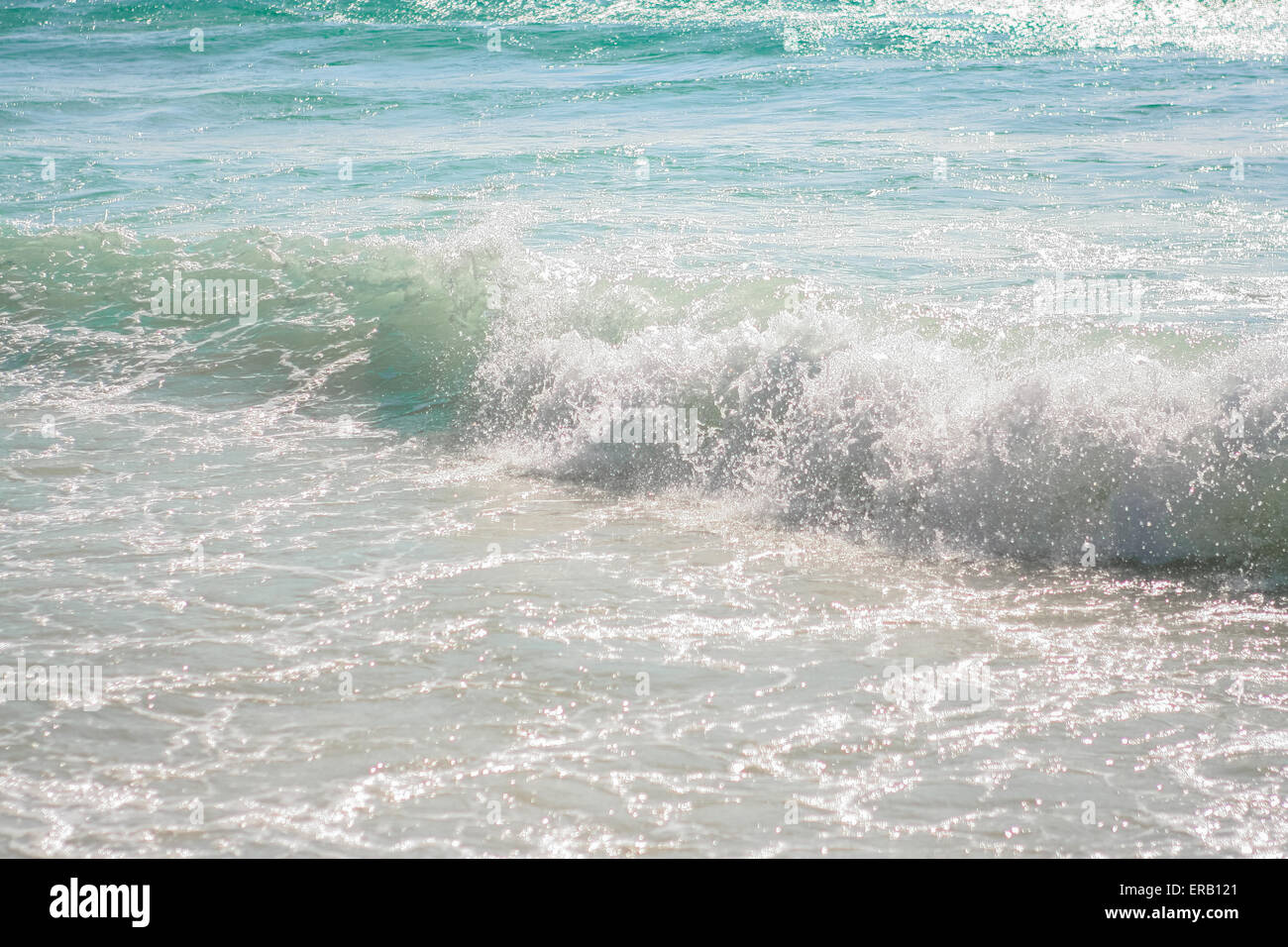 Blue sea with white foam on the tropical island Stock Photo - Alamy