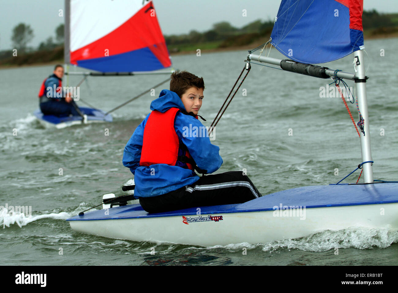 Youngsters sailing Topper dinghies at Hengistbury Head Centre, Dorset ...