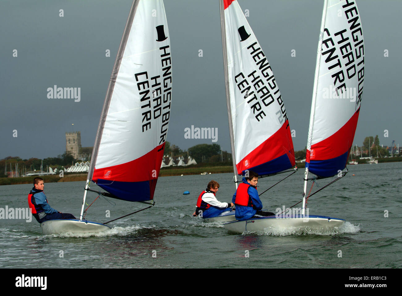 Youngsters sailing Topper dinghies at Hengistbury Head Centre, Dorset ...