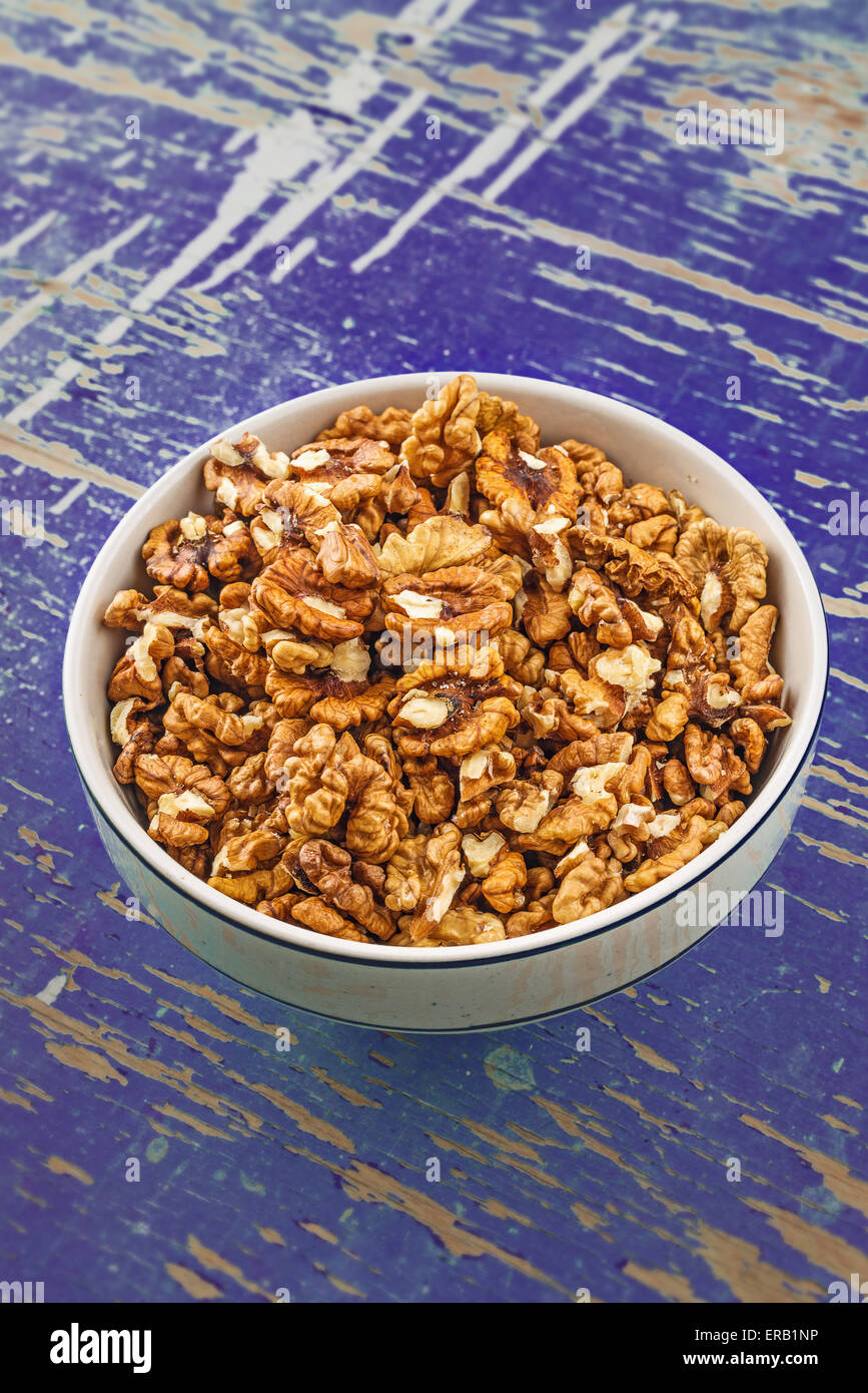 Peeled Walnut Kernels in Ceramic Bowl on Purple Rustic Wood Plank ...
