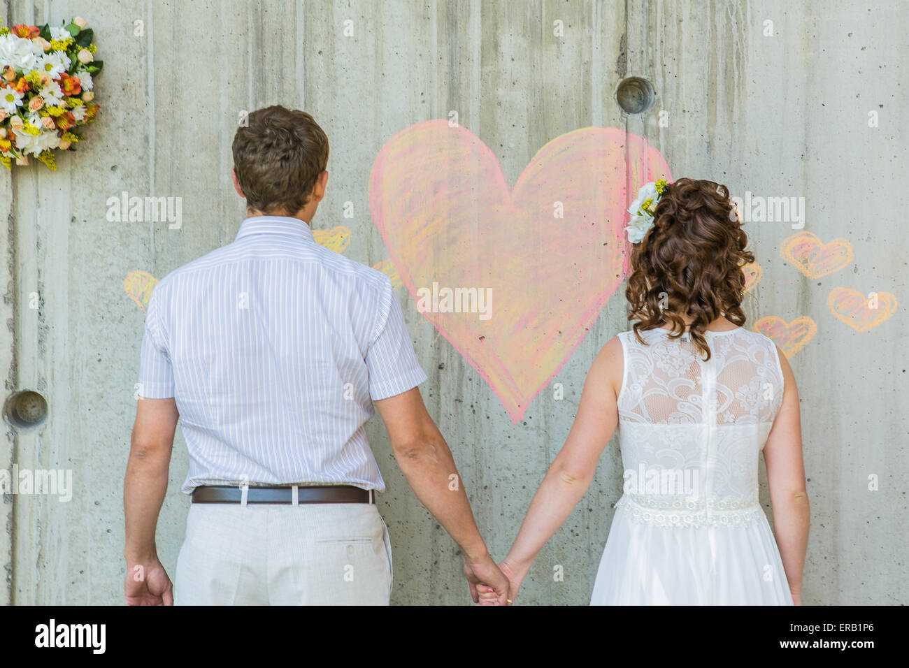 Bride's and groom's backs Stock Photo - Alamy