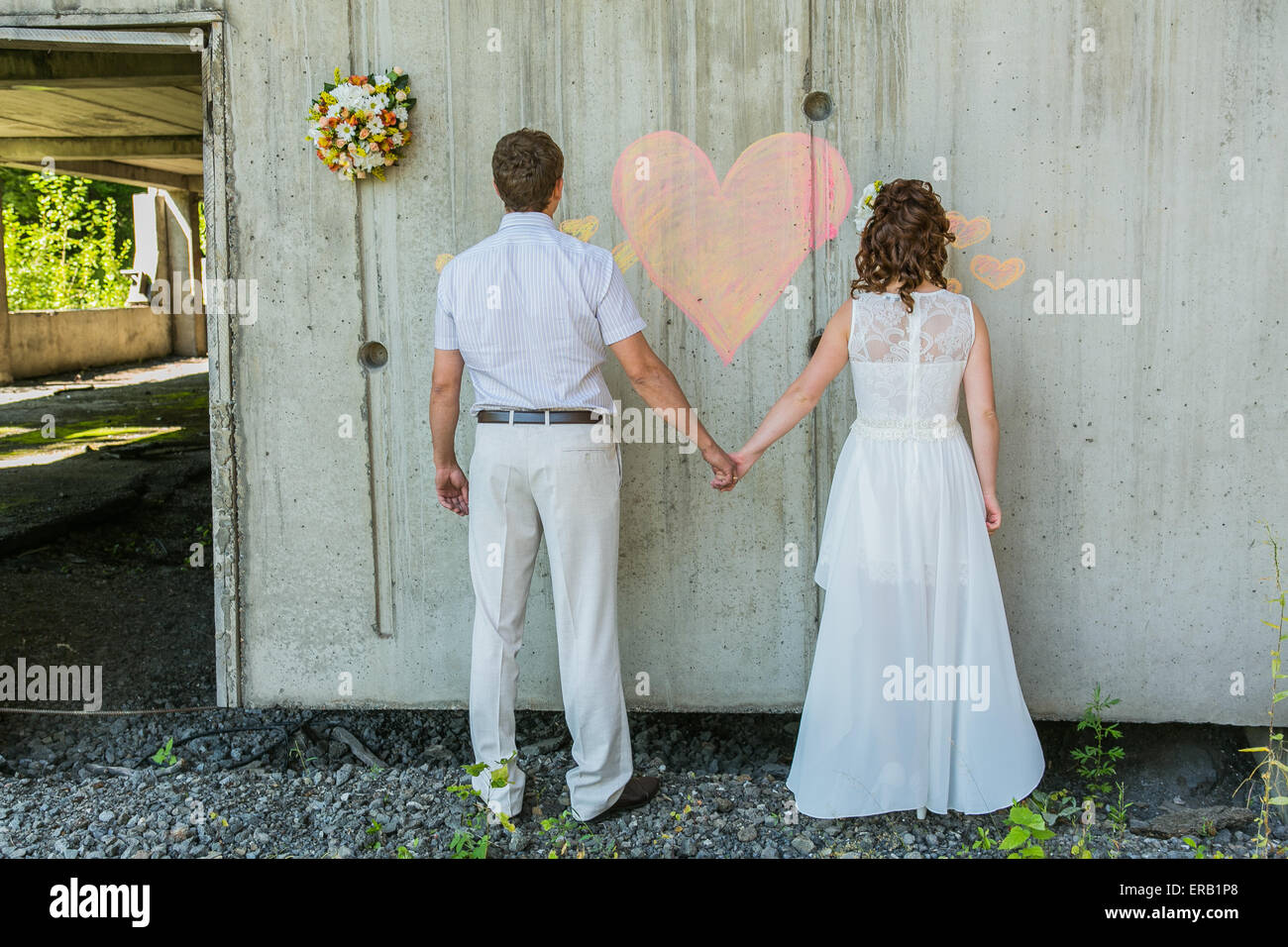 Bride's and groom's backs Stock Photo - Alamy