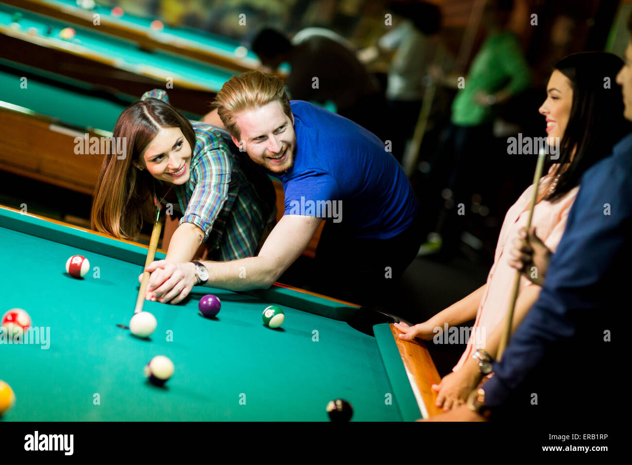 Young couple playing pool Stock Photo - Alamy