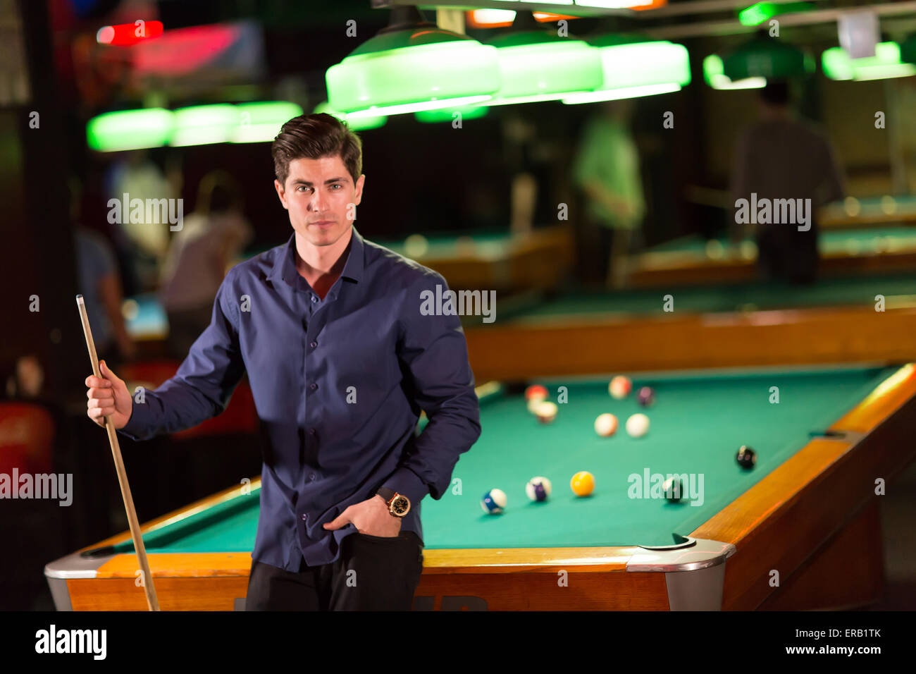 Young man playing pool Stock Photo - Alamy