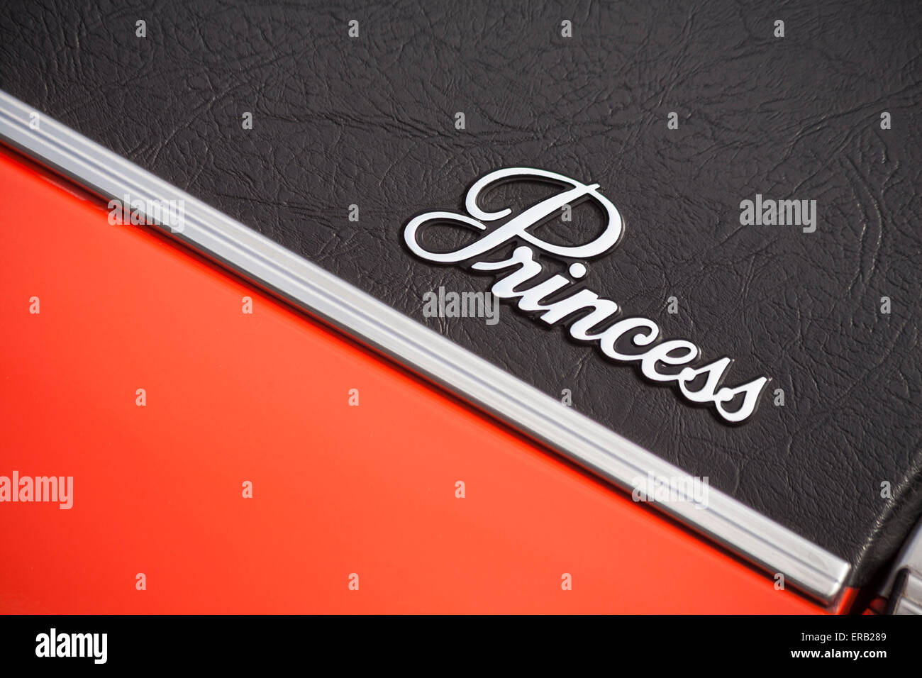 Princess badge on black and red orange coloured car Stock Photo - Alamy