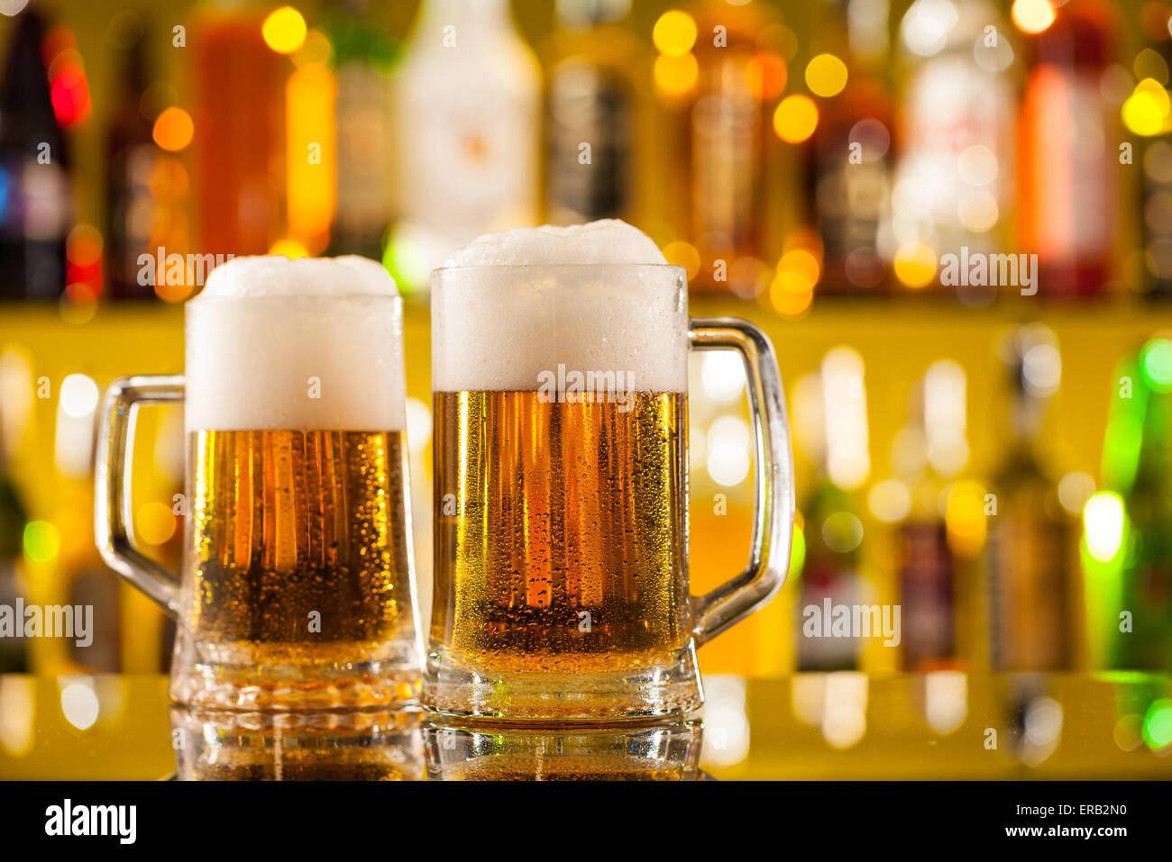 Jugs of beer placed on bar counter with copyspace Stock Photo - Alamy
