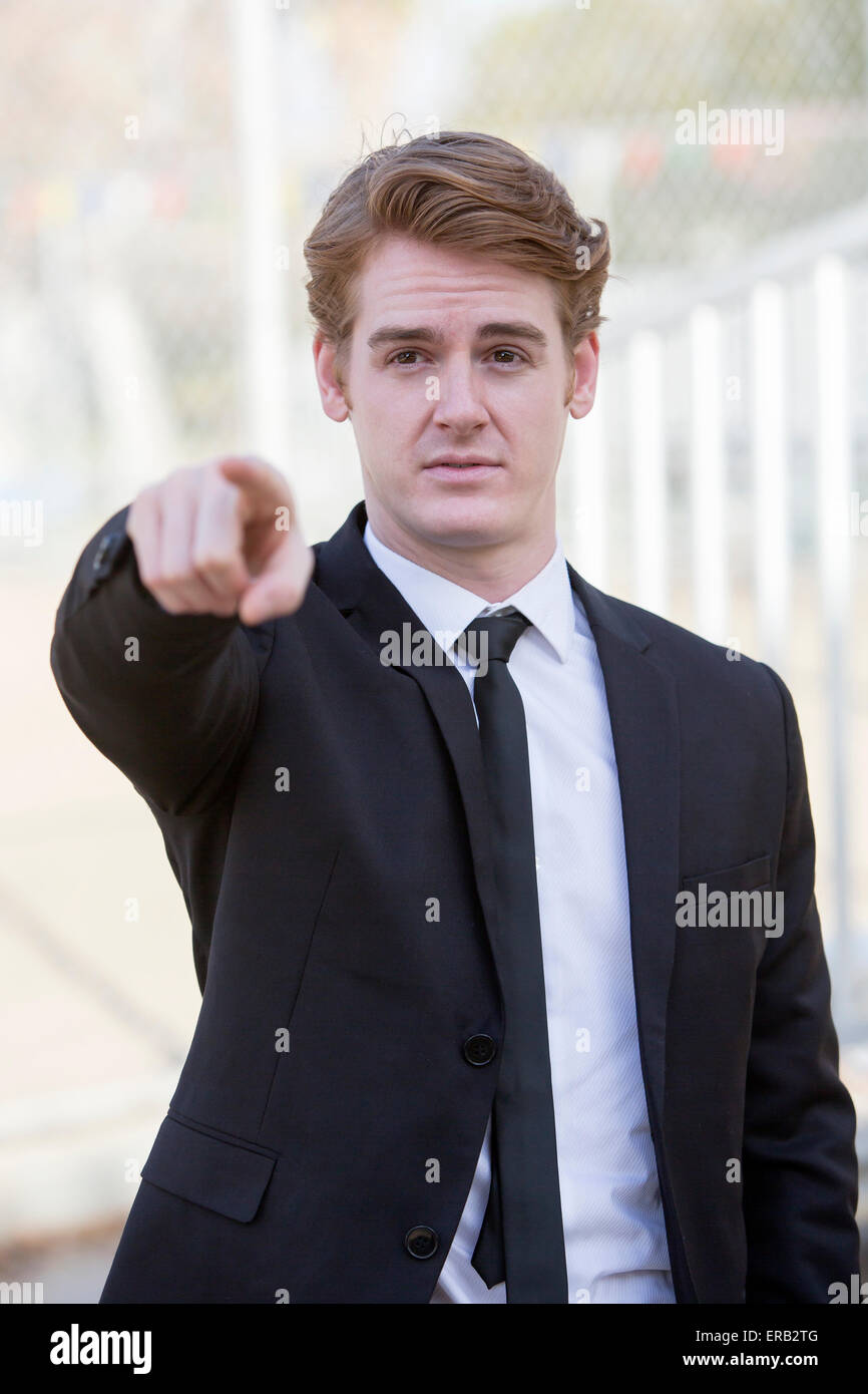 Business person pointing outside hi-res stock photography and images ...