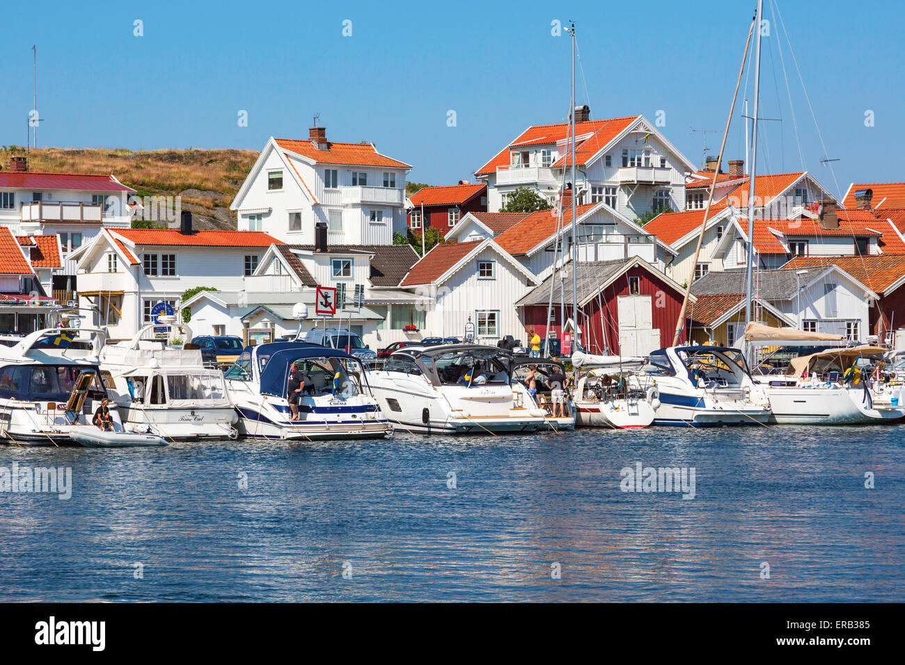 Boats lying at the jetty in the seaside village in Grundsund at Swedish ...