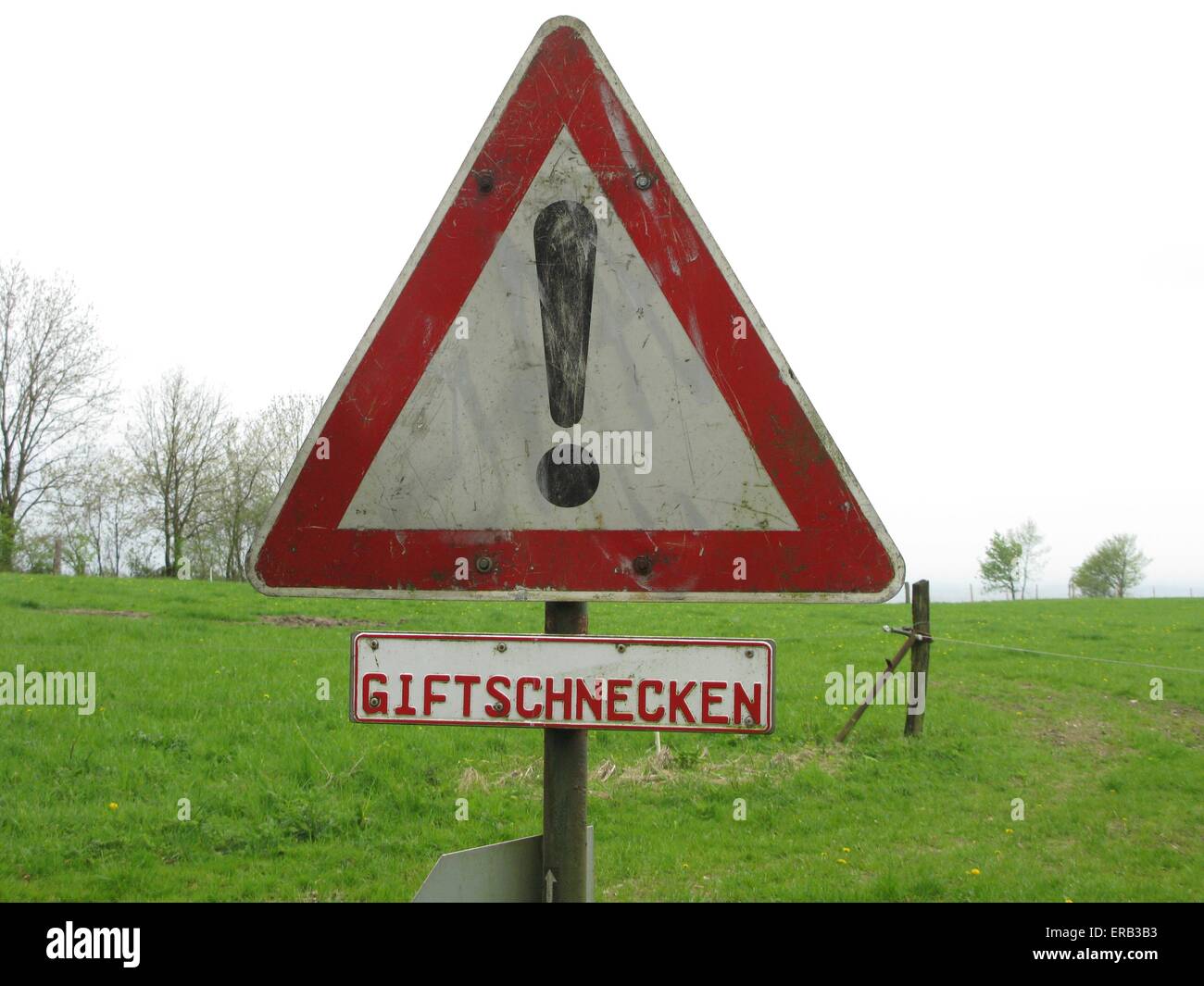 Funny sign warning of poisonous snails Stock Photo - Alamy