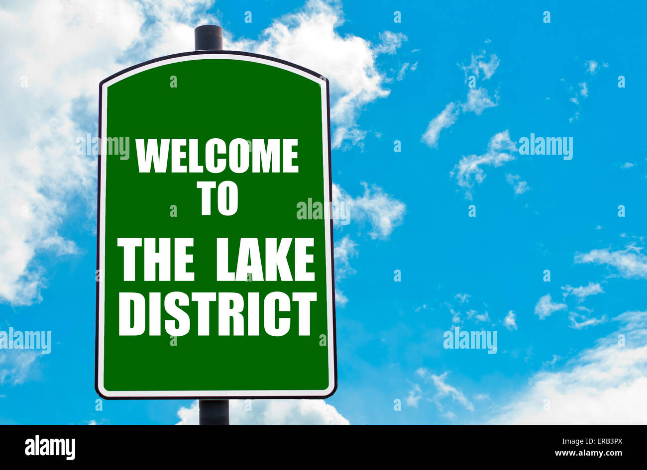 Green road sign with greeting message WELCOME TO THE LAKE DISTRICT ...