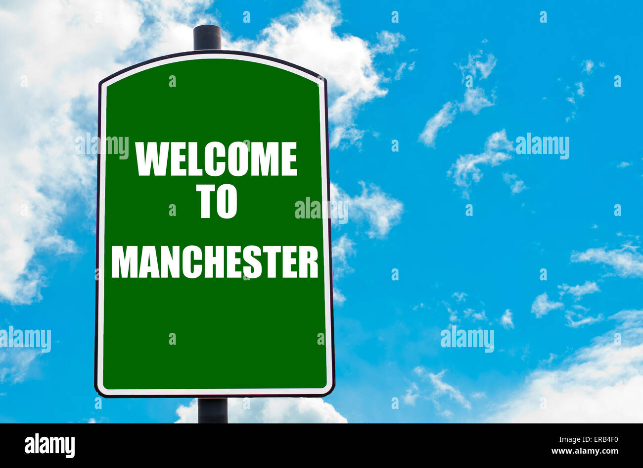Green road sign with greeting message WELCOME TO MANCHESTER, ENGLAND ...